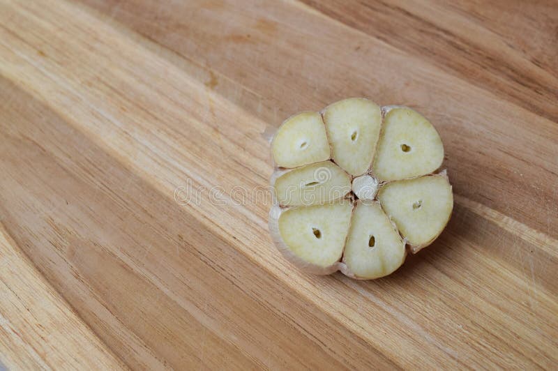 A Kitchen Spice with Whole Garlic Cut in Half Stock Image - Image of ...