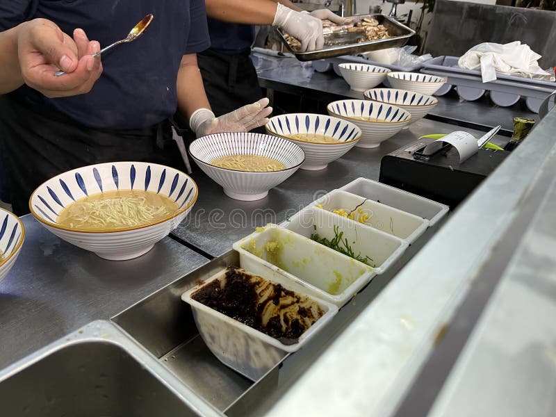 Kitchen Staff Preparing Traditional Japanese Ramen Stock Photo - Image ...