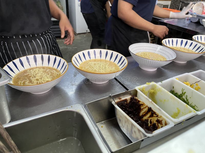 Kitchen Staff Preparing Traditional Japanese Ramen Stock Photo - Image ...