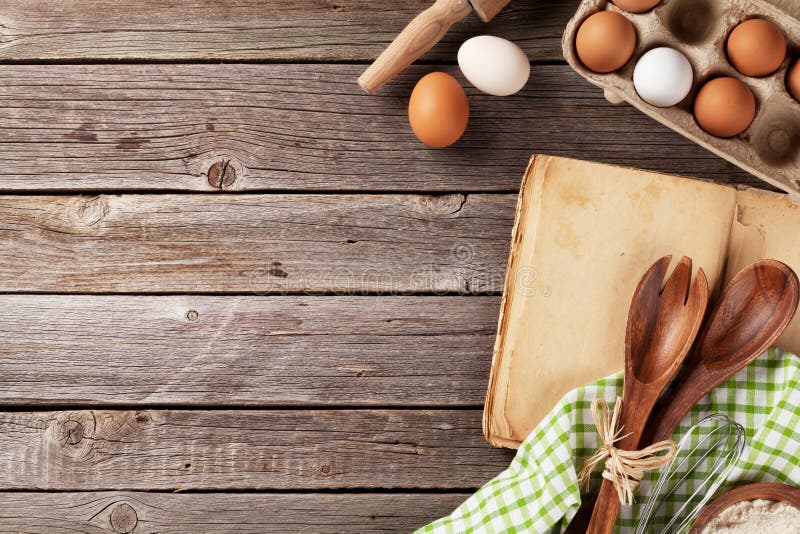 Kitchen Table with Cookbook, Utensils and Ingredients Stock Photo ...