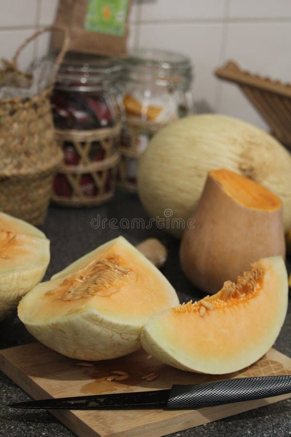 Kitchen Table with Cut and Whole Melons Stock Image - Image of ...