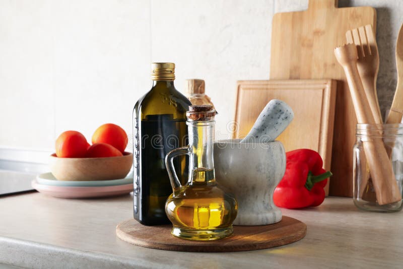 Kitchen Table with Different Supplies and Bottles with Oil Stock Image ...