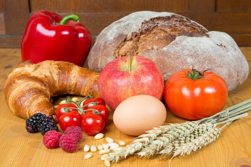 Kitchen Table with a Lot of Food Like Bread and Vegetables Stock Image ...