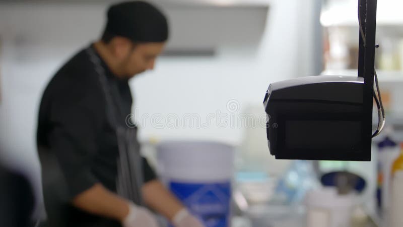 Kitchen Ticket Printer with Hispanic Chefs As Background Stock Footage ...