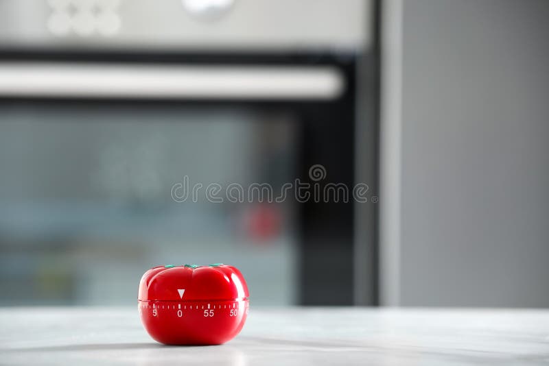 Kitchen Timer in Shape of Tomato on Light Grey Table Indoors. Space for ...