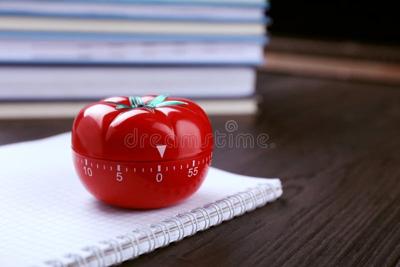 Kitchen Timer in Shape of Tomato and Notebook on Wooden Table, Closeup ...