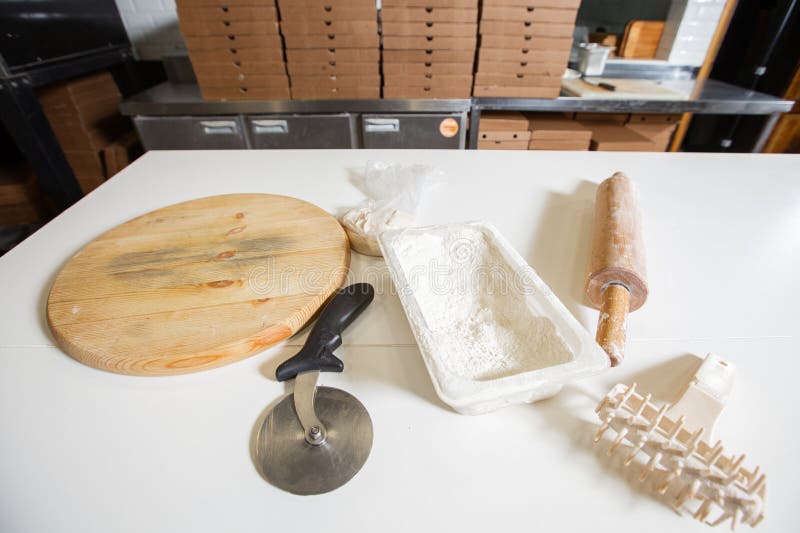 A Kitchen Tool for Making Dough. Dough for Pizza, the Chef Rolls Out ...