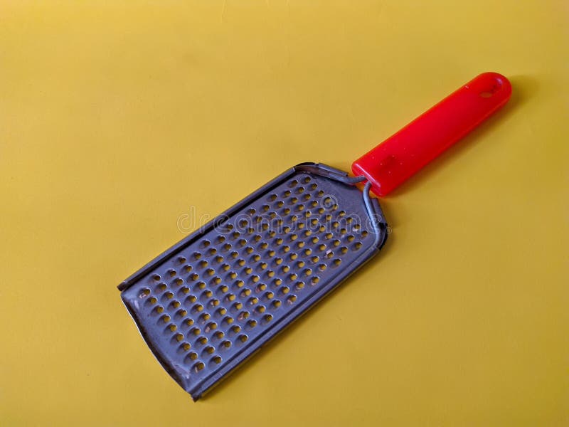 Kitchen Utensil, a Cheese Grater with a Red Handle Stock Image - Image ...