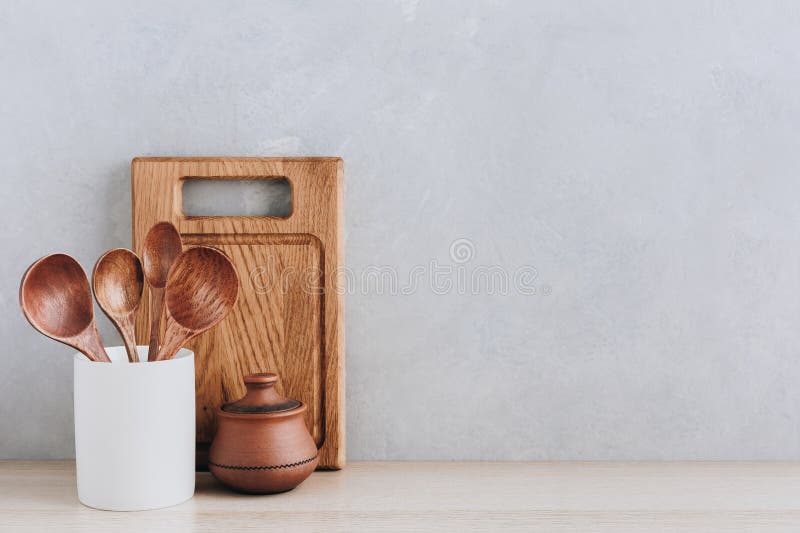 Kitchen Utensils Background. Wooden Spoons and Cutting Board on Light ...