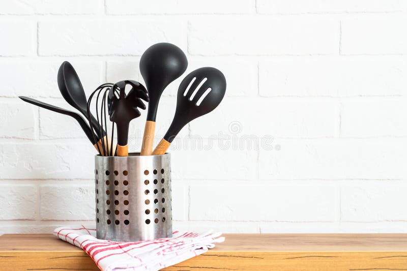 Kitchen Utensils in Container Near White Wall. Stock Image - Image of ...