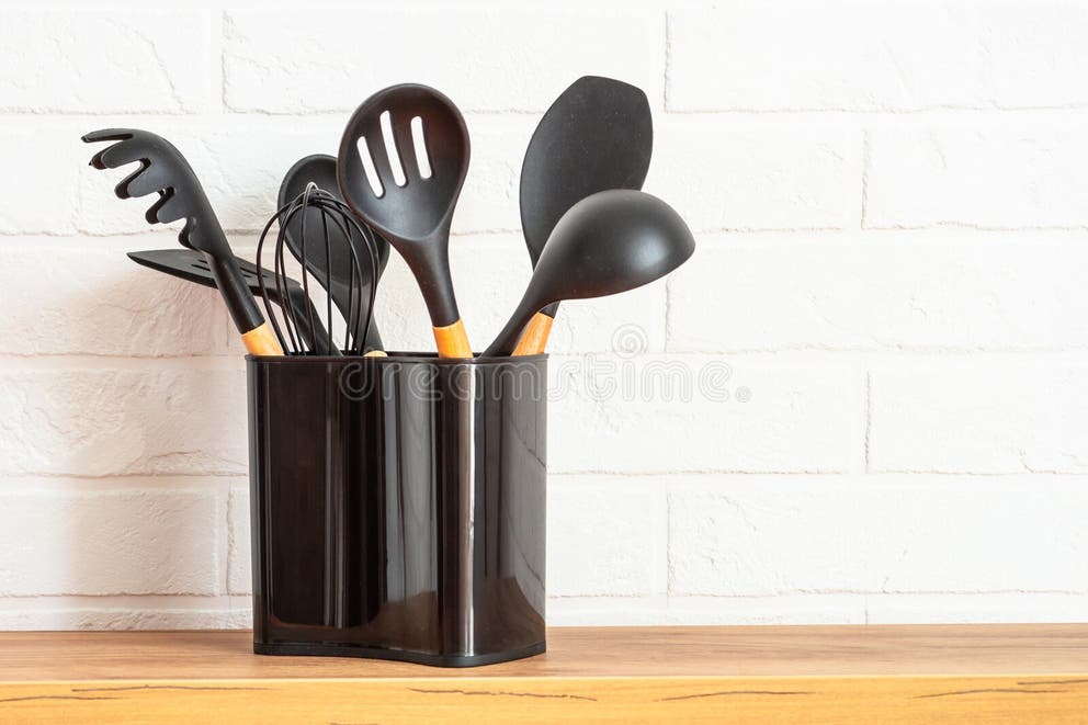 Kitchen Utensils in Container Near White Wall. Stock Image - Image of ...