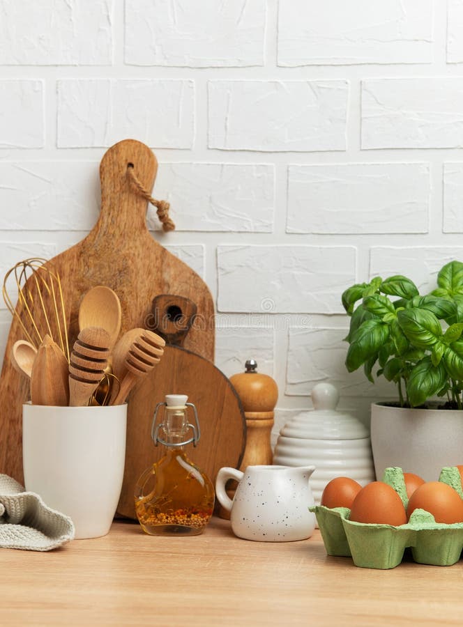 Kitchen Utensils, Eggs, and Basil Creating a Rustic Culinary Scene on ...