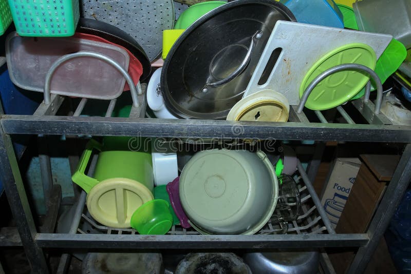 Kitchen Utensils in the Form of Plates on the Shelf Stock Photo - Image ...