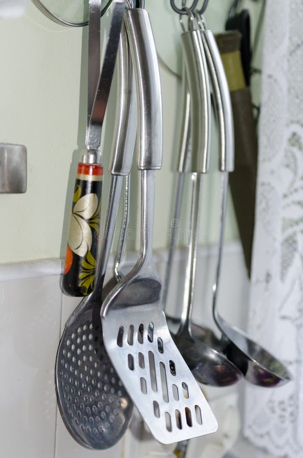Kitchen Utensils Hanging in Kitchen Stock Photo - Image of metal ...