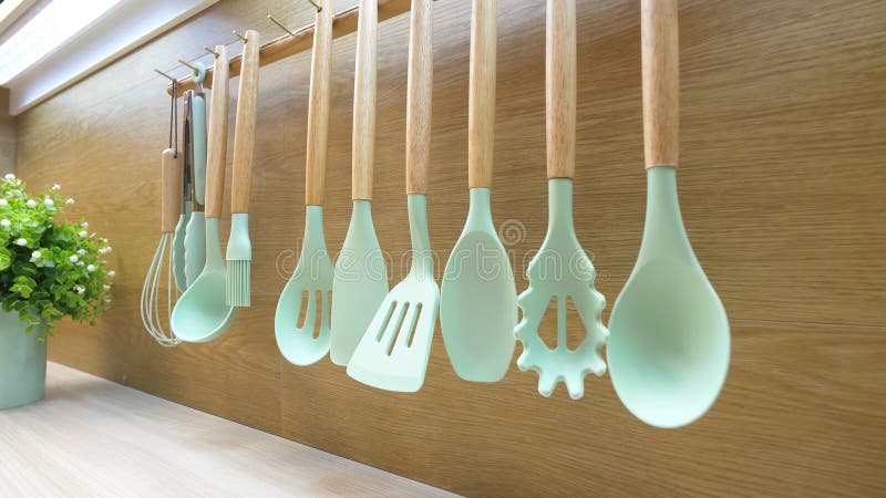Kitchen utensils in a row stock footage. Video of kitchenware - 326787226
