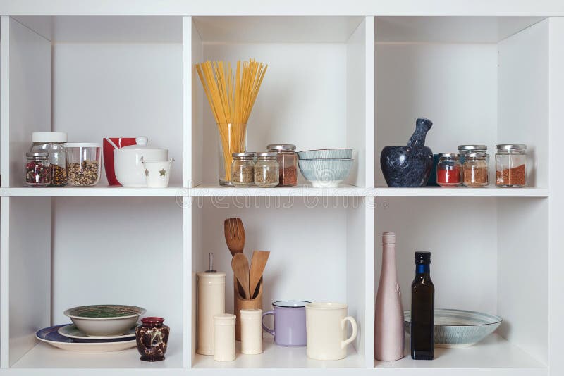 Kitchen Utensils and Tableware on White Shelves. Well Organized Kitchen ...