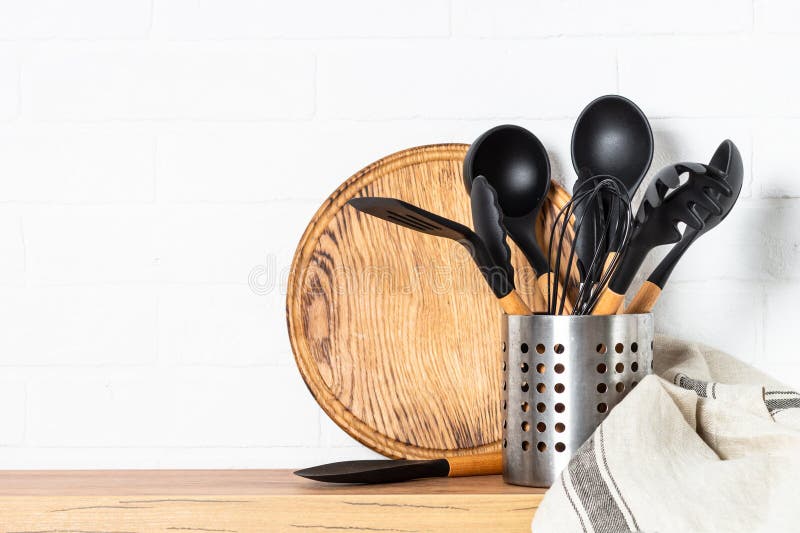 Kitchen Utensils with Wooden Cutting Board Near White Wall. Stock Image ...