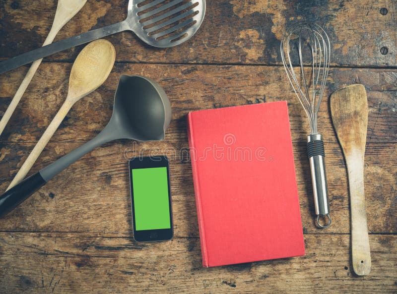 Kitchen Utensils on Wooden Table with Book and Smart Phone Stock Photo ...