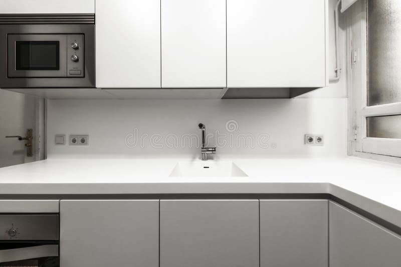 Kitchen with White One-piece Countertop Stock Photo - Image of stylish ...