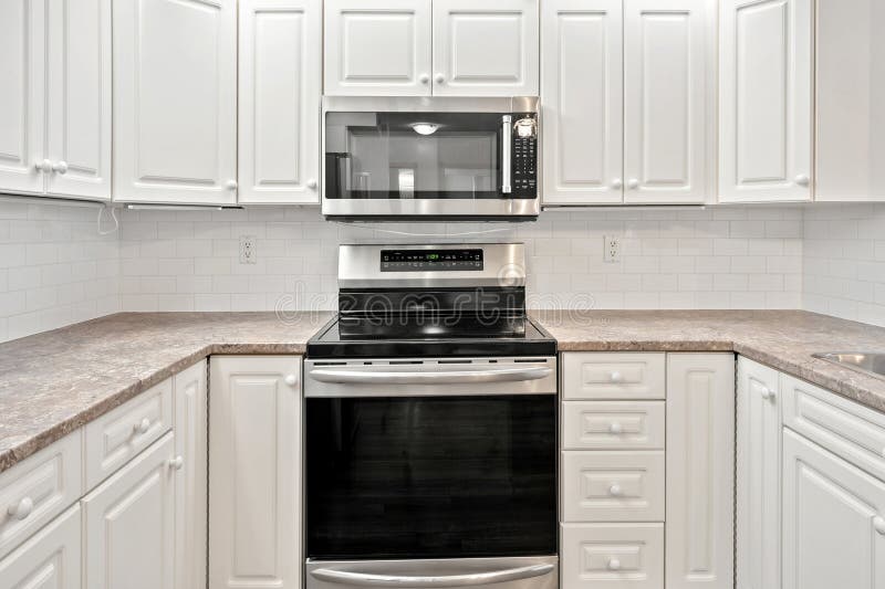 Kitchen with a White Stove and Microwave Stock Photo - Image of home, indoor: 359862880