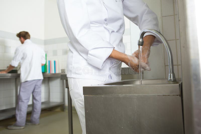 Kitchen Worker Washing Hands Stock Photo - Image of canteen, liquid ...