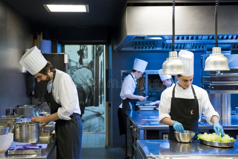 Kitchen workers editorial stock photo. Image of preparing - 58386403
