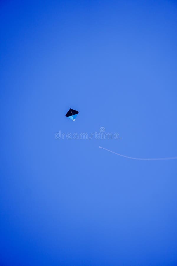 Kite Flying High in Clear Blue Sky Stock Photo - Image of peaceful ...
