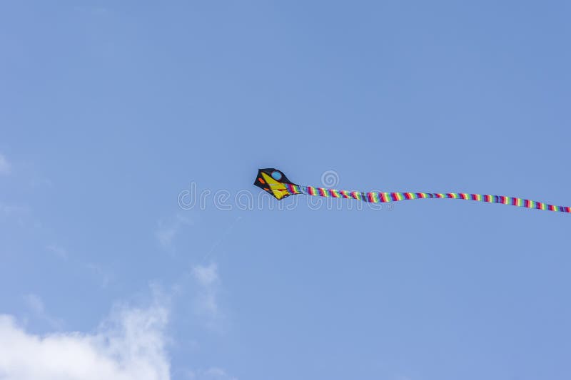 Kite Flying in the Sky among the Clouds Stock Photo - Image of color ...
