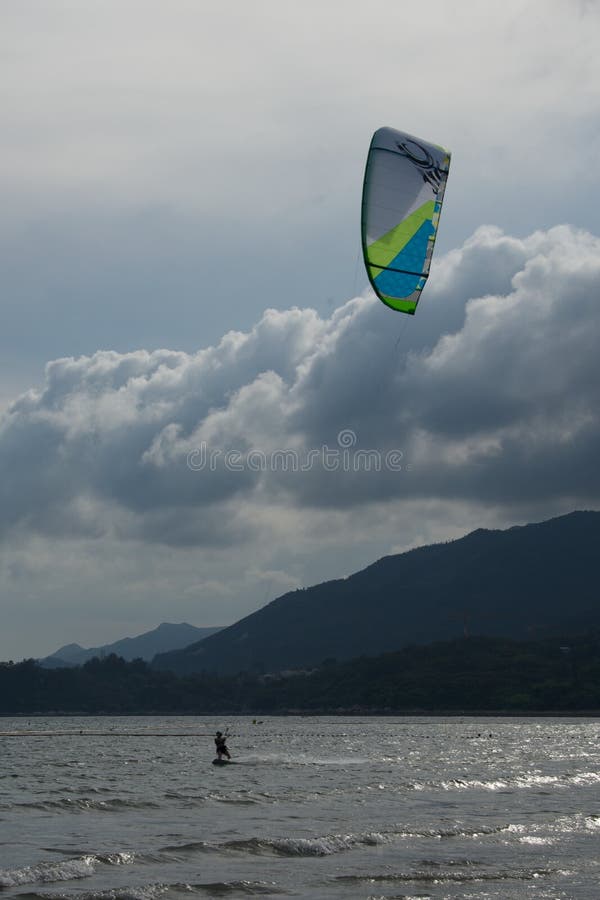 Kite Surfer with Green and Blue Kite Stock Image - Image of green ...
