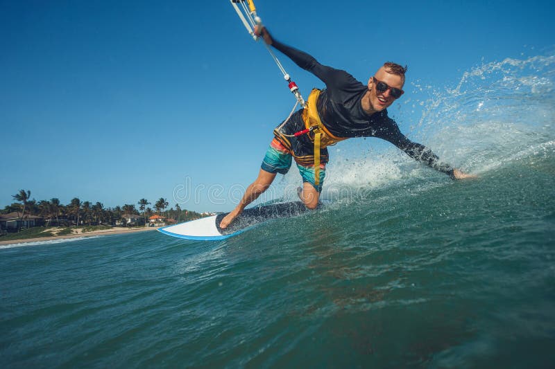 Kite Surfer Riding a Kiteboard on the Sea Stock Photo - Image of foam ...