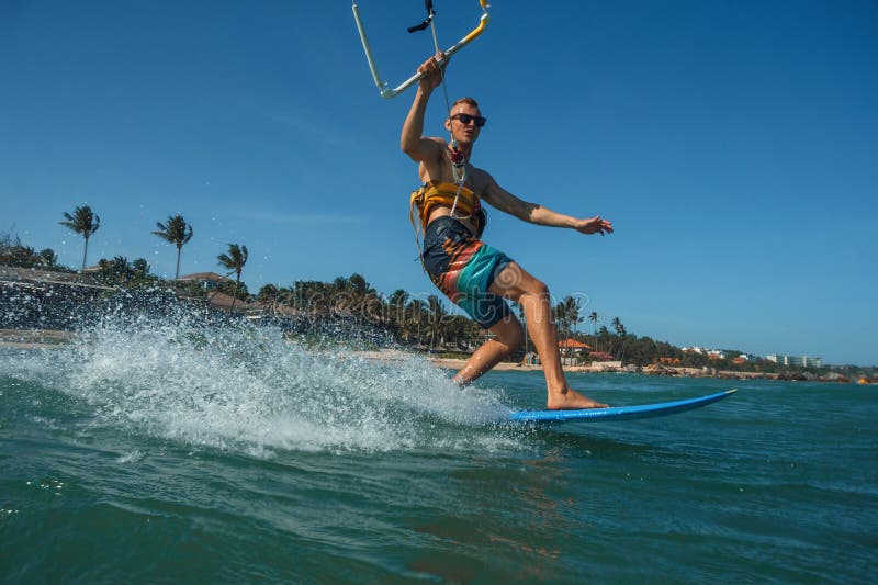 Kite Surfer Riding a Kiteboard on the Sea Stock Photo - Image of surfer ...