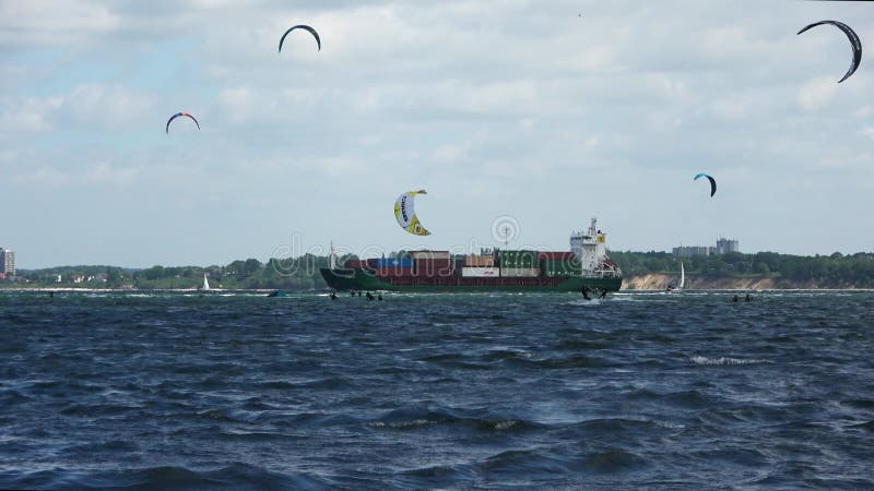 Kite Surfing Activity in Front of Big Cargo Ships at the Beach of Laboe ...