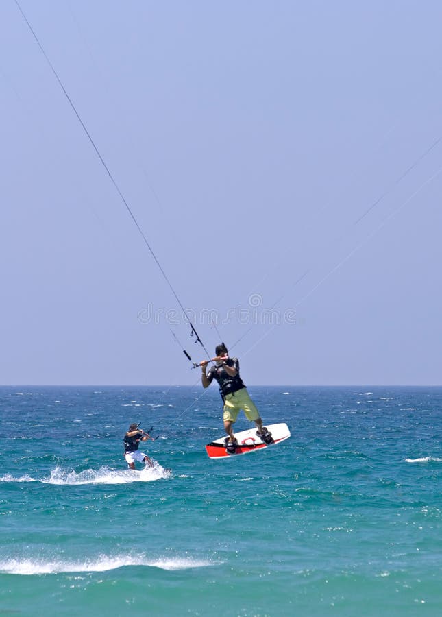 Kitesurfer Flying through the Air on a Sunny Beach Stock Photo - Image ...