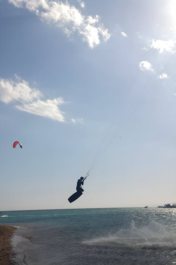 Kitesurfer Flying High in the Sky Stock Image - Image of surfing, high ...