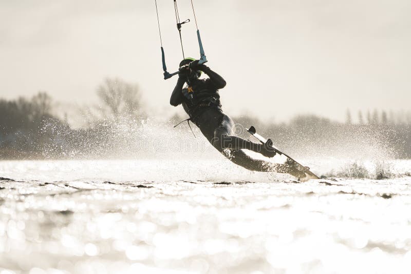 Kitesurfer Performing a Darkslide Trick in Backlit Conditions Stock ...