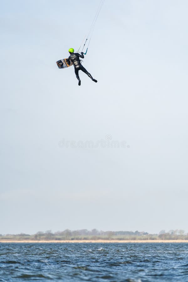 Kitesurfer Performs Massive Jump with Board Off Trick and Water Surface ...