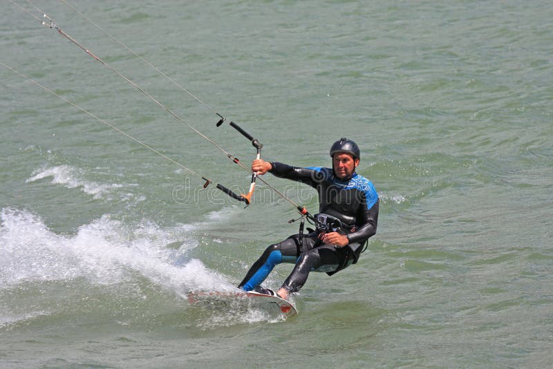 Kitesurfer riding at speed stock image. Image of flat - 144811057