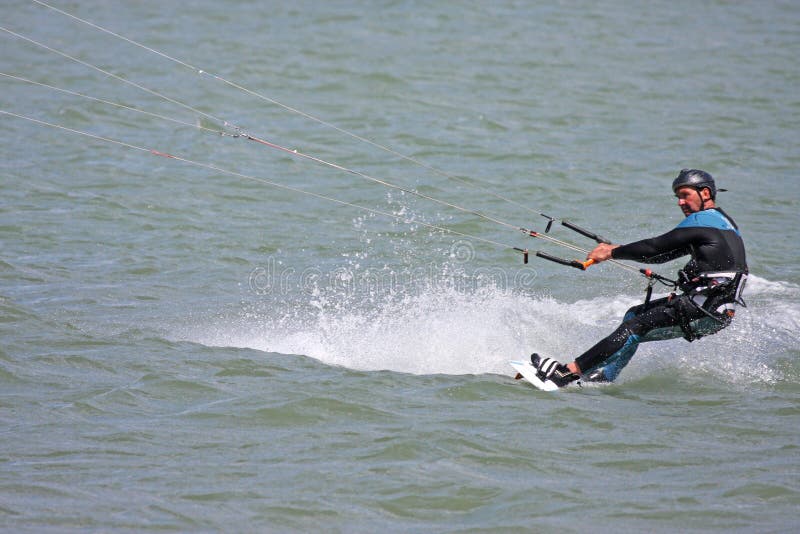 Kitesurfer riding board stock image. Image of extreme - 131889385