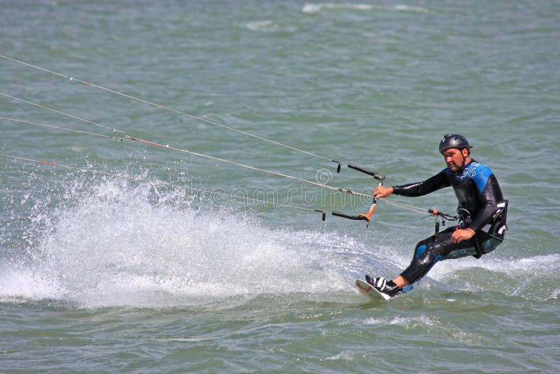 Kitesurfer riding at speed stock image. Image of sport - 148270723