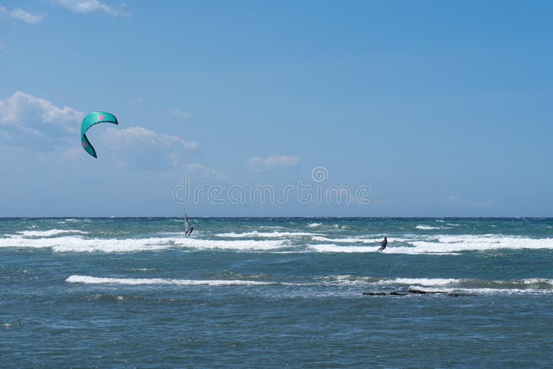 Kitesurfing and Windsurfing during a Windy Day with a Very Rough Sea ...