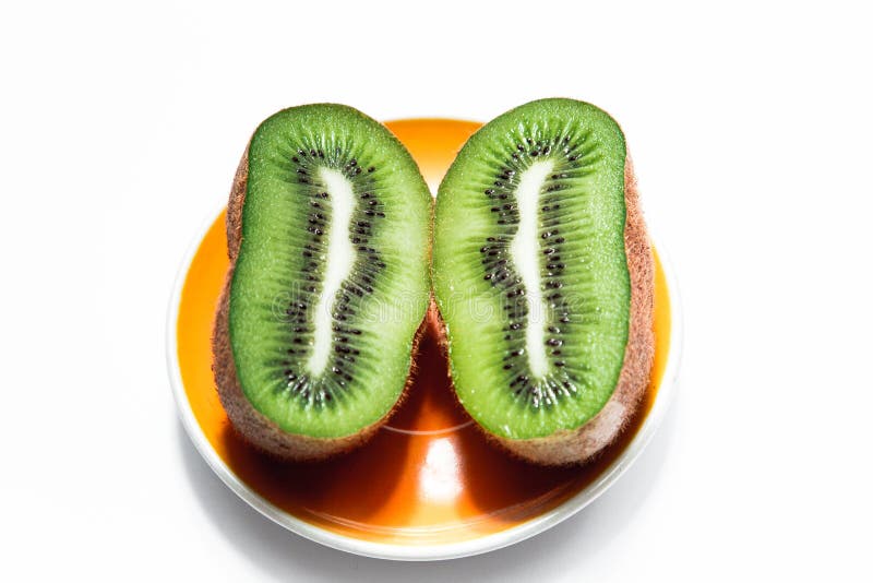 Kivin Cut into Orange Plate Stock Image - Image of dieting, juicy ...
