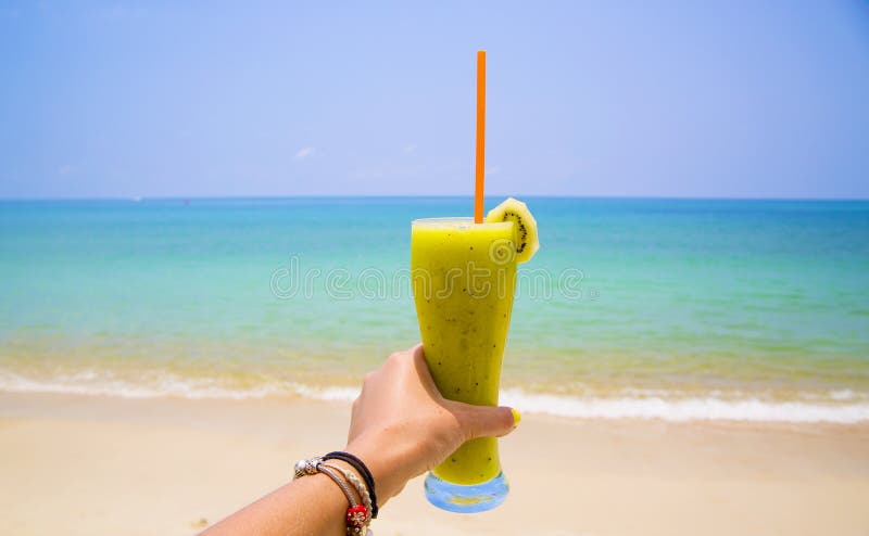 Kiwi cocktail on the beach stock image. Image of summer - 39628547