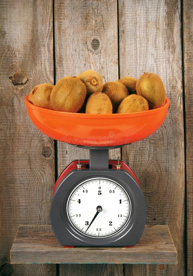 Kiwi on scales stock image. Image of market, board, ingredient - 44676941