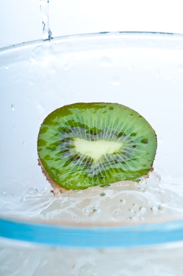 Kiwi into water splash stock photo. Image of bubble, juicy - 16144752