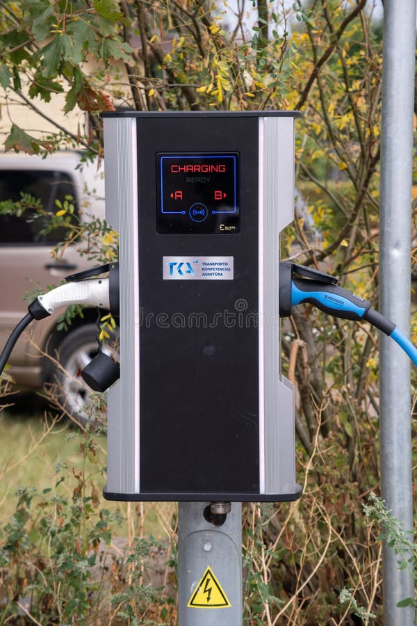 A Static Shot of a Solid Black Tesla Model 3 Dual Motor Charging at the ...