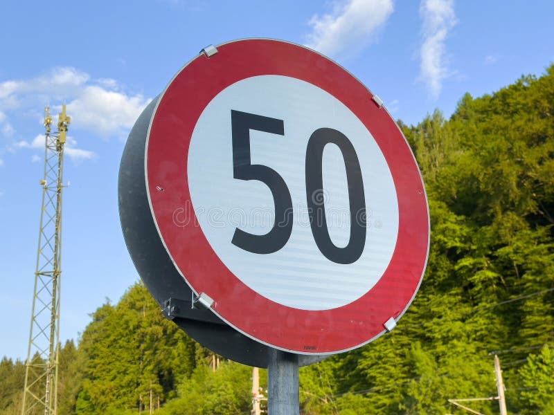 50 Km H Speed Limit Sign Against Lush Green Forest Background Stock ...