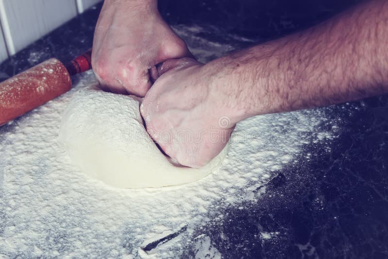 Knead flour toned dough stock image. Image of male, kneading - 89324615