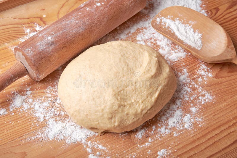 Kneaded Dough on a Rolling Plate with Spilled Wheat Flour Stock Photo ...