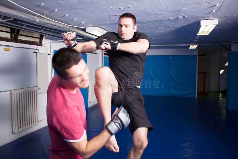 Knee Kick during Mma Training Stock Photo - Image of blue, barefoot ...