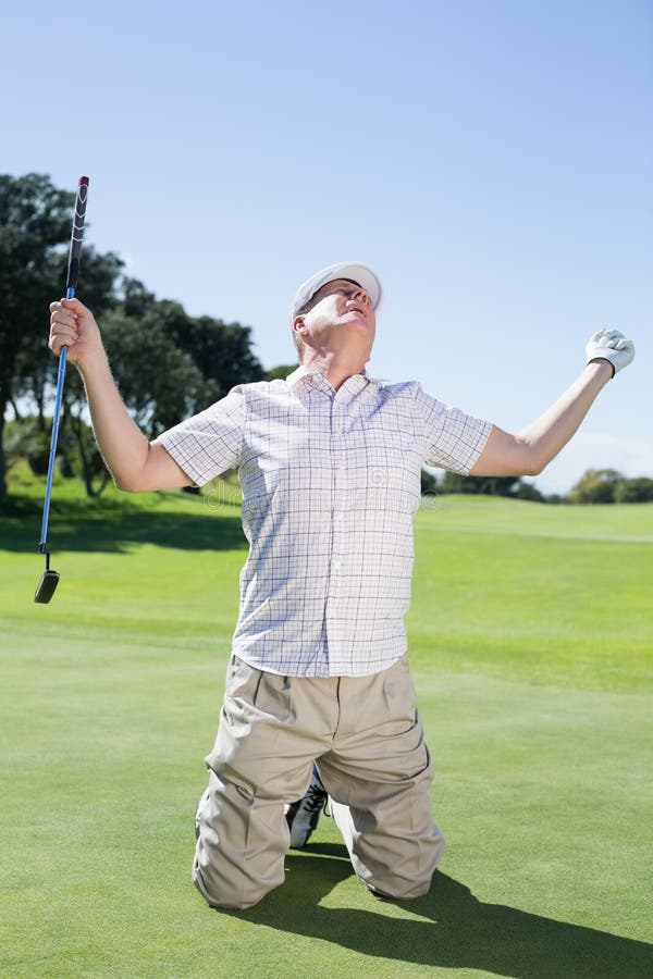 Kneeling Golfer Cheering on Putting Green Stock Photo - Image of ...
